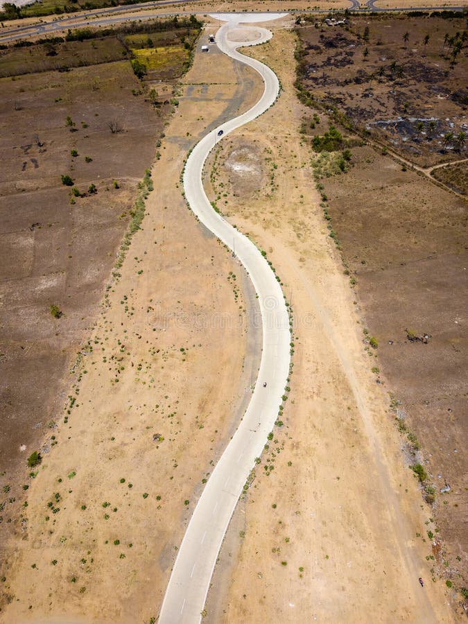 Aerial View of a Winding, S Shaped Road through a Sandy, Dry Landscape ...