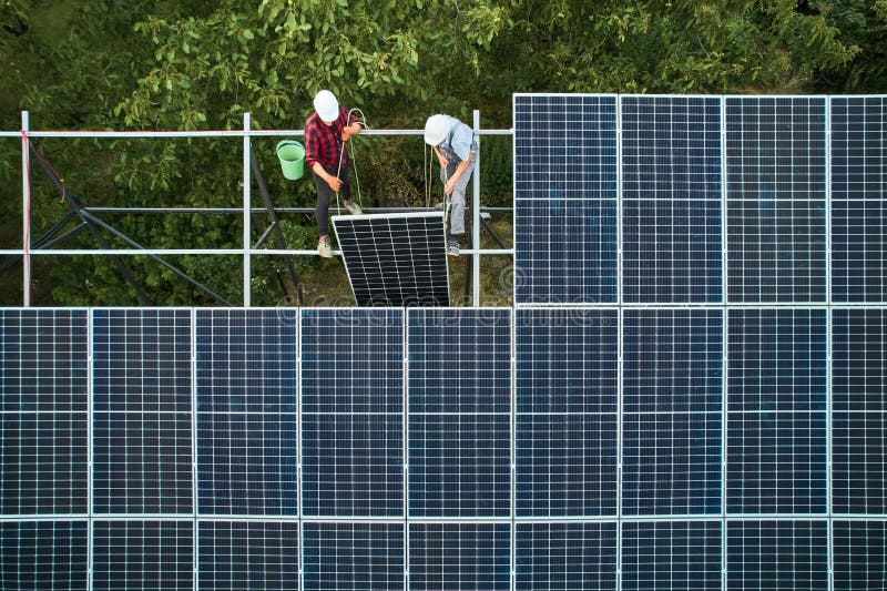 Aerial View of Workers Installing Solar Panels Stock Photo - Image of ...