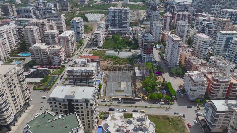Aerial View: Workers Insulate Building Foundations and Install Metal ...