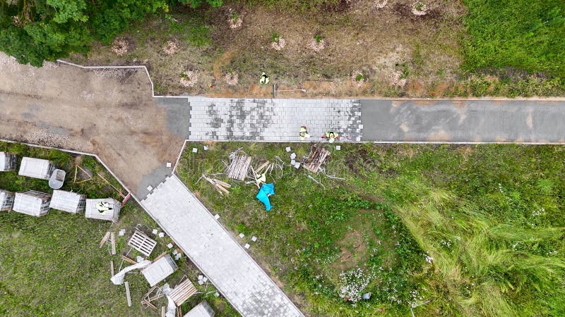Aerial View of Workers Laying Pavement Tiles Stock Video - Video of ...