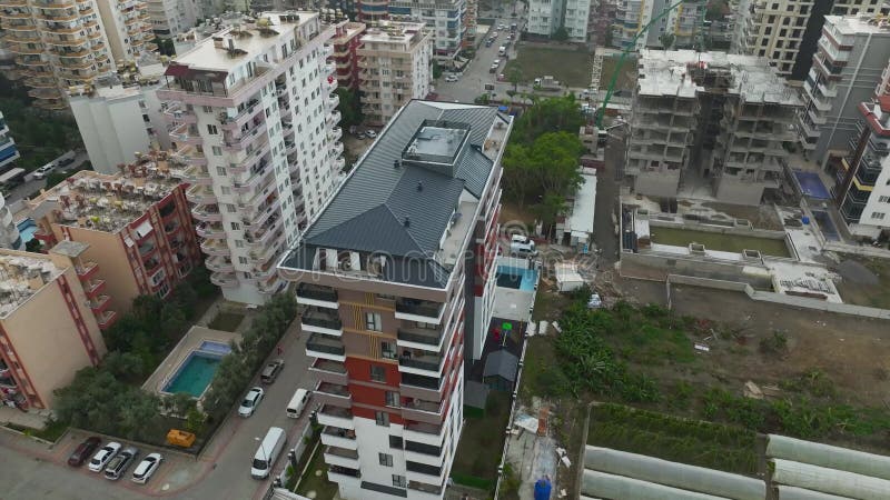 Aerial View: Workers Skillfully Pour Concrete while Engineers Monitor ...