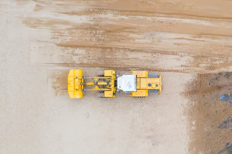 Aerial View of the Working Yellow Earth Mover Grader Flattens the ...