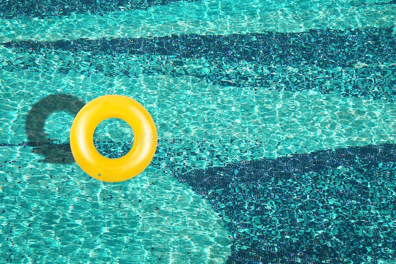 Aerial View of Yellow Ring Float in a Swimming Pool Under Bright Sunny ...
