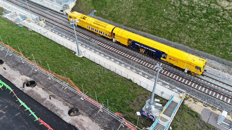 Aerial View of a Yellow Train on the Tracks at EWR Winslow Station ...