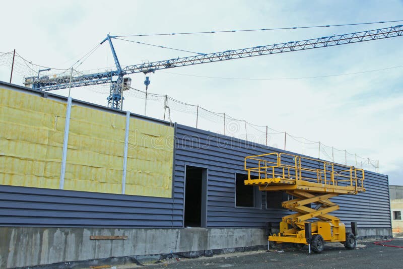 Aerial Work Platform on an Insulation Site of a Commercial Building ...
