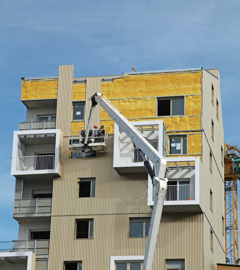 Aerial Work Platforms on an Insulation Site of a Building Stock Photo ...