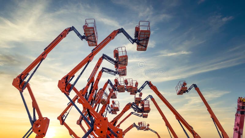 Aerial Work Platforms Lined Up of Cherry Picker Against Blue Sky with ...