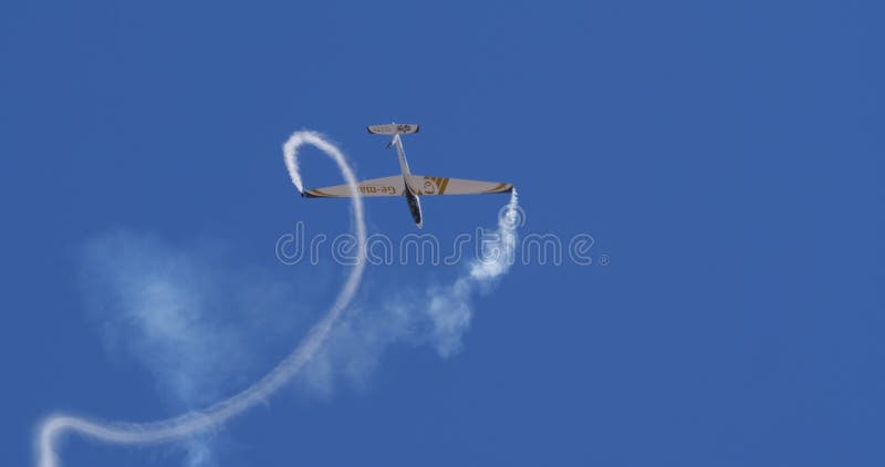 Aerobatic Glider Executing Loop with Smoke Trails and Copy Space ...