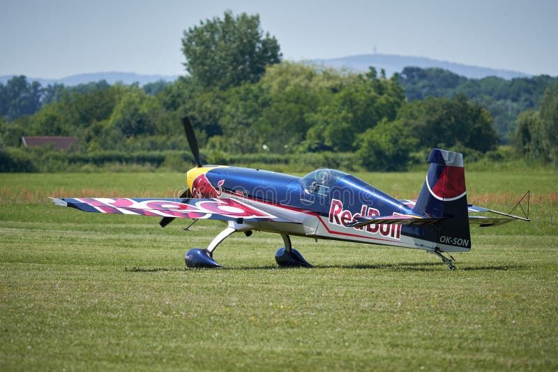 An Aerobatic Plane Performs a Maneuver Against Blured Background ...
