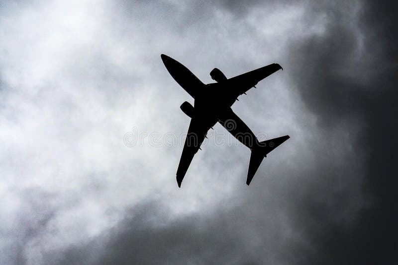 Aeroplane Flying in the Cloudy Weather Conditions Stock Photo - Image ...
