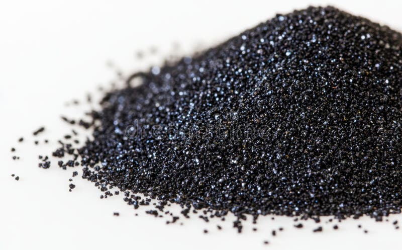 An Aesthetic Composition of Black Powder Scattered on White Highlights ...