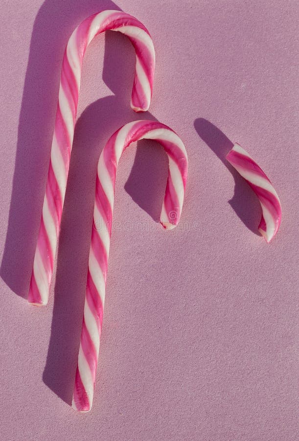 Aesthetic Composition of Two Candy Canes on a Pink Background Stock ...
