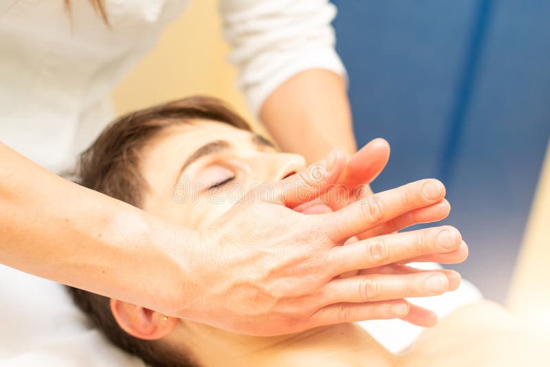 In the Aesthetic Studio a Relaxing Facial Massage is Performed Stock ...