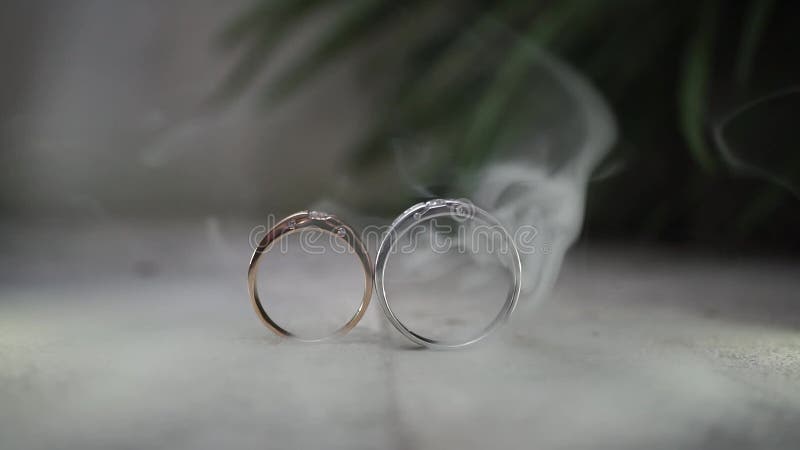 Wedding Rings on a Floor with Smoke Stock Footage - Video of couple ...