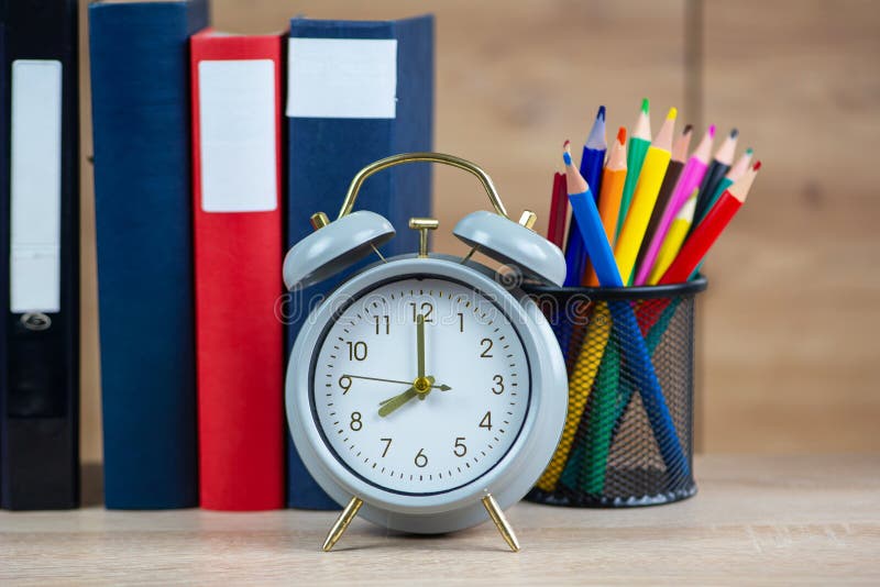 An Aesthetically Pleasing Classic Desk Setup Featuring a Clock and an ...