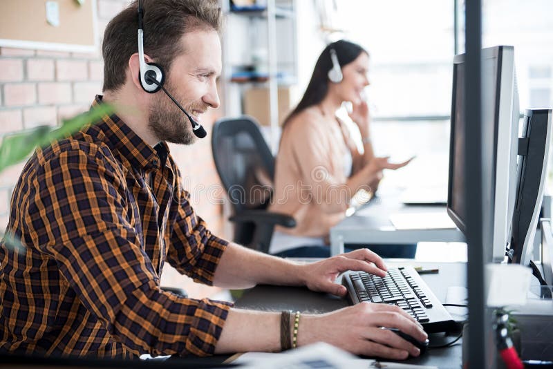 Affable Employee Using Computer for Work Stock Photo - Image of ...