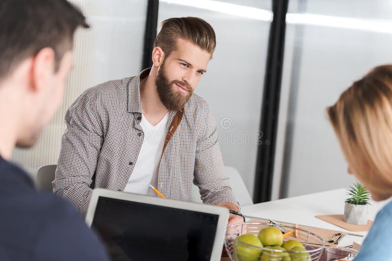 Affable Smiling Bearded Manager among Co-workers Stock Photo - Image of ...
