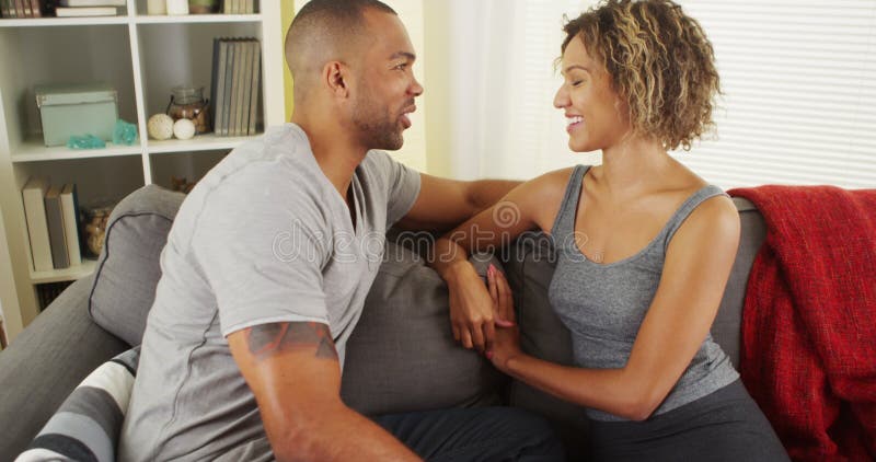 Affectionate Black Couple Talking on Couch Stock Video - Video of adult, serious: 257870165