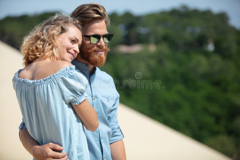 Affectionate Couple Cuddling at Beach Stock Image - Image of elegance ...