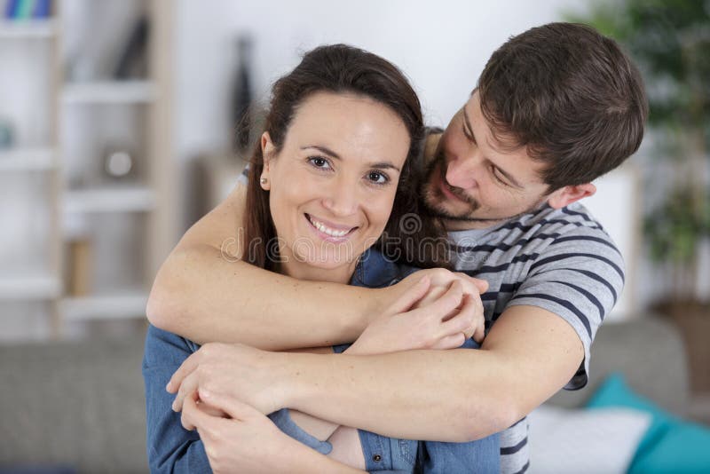 Affectionate Couple Embracing Woman Looking at Camera Stock Image ...