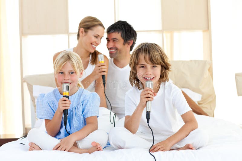 Affectionate Family Singing Together Stock Photo - Image of sitting ...