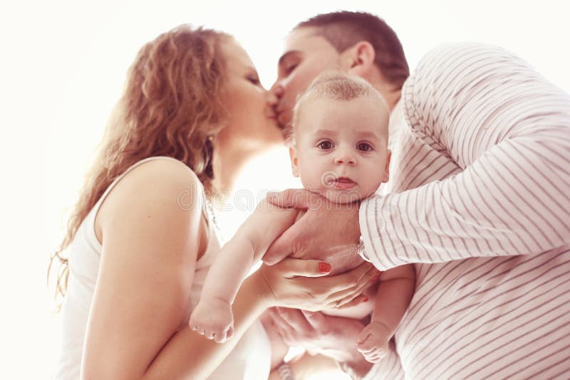 Affectionate Parents Holding Their Baby Boy Stock Image - Image of baby ...