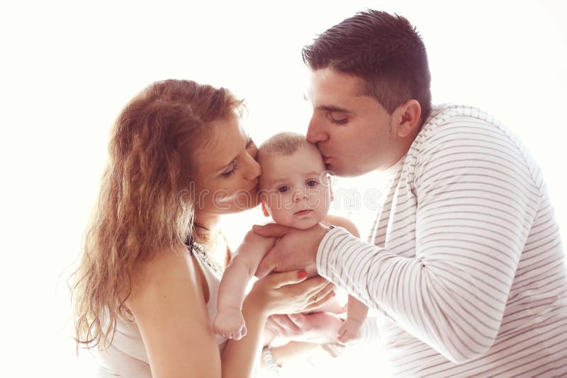 Affectionate Parents Holding Their Baby Boy Stock Image - Image: 57946683