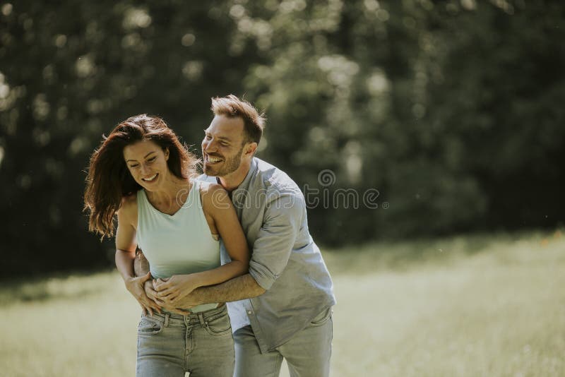 Affectionate Young Couple Having Fun on the Green Grass Stock Image ...