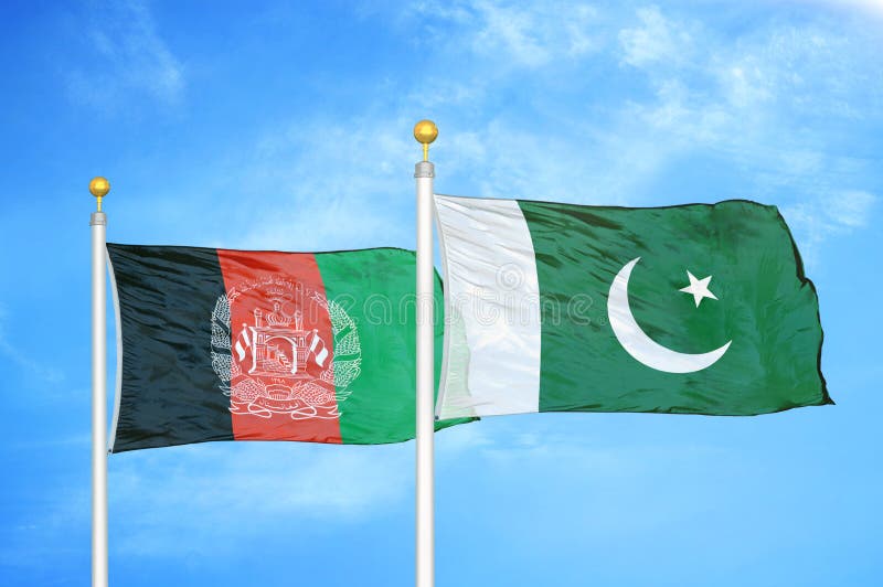 Afghanistan and Pakistan Two Flags on Flagpoles and Blue Cloudy Sky ...
