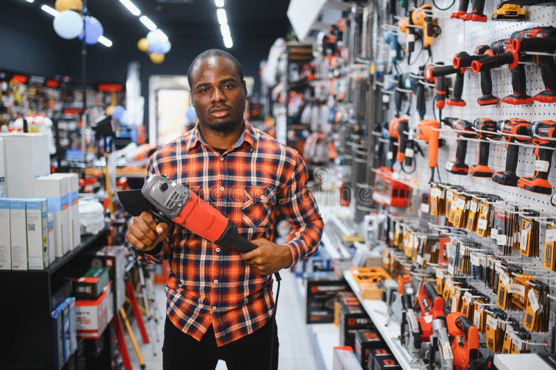 African Americam Man Buying Modern Electric Drill while Standing in ...