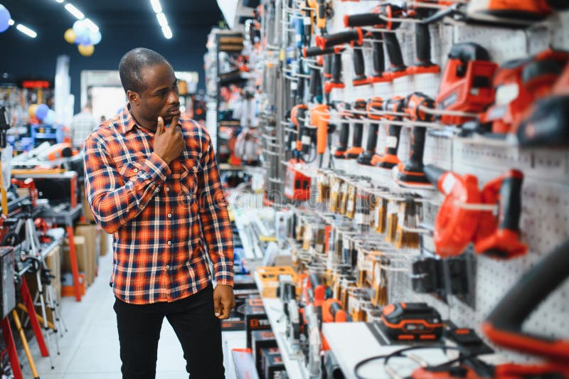 African Americam Man Buying Modern Electric Drill while Standing in ...