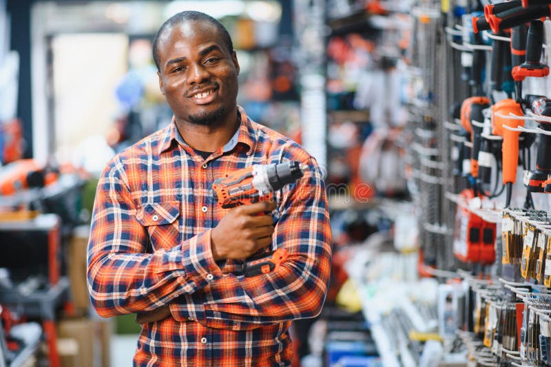 African Americam Man Buying Modern Electric Drill while Standing in ...