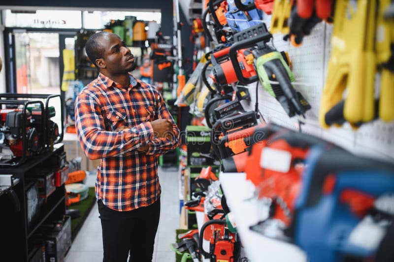 African Americam Man Buying Modern Electric Drill Standing Tool ...