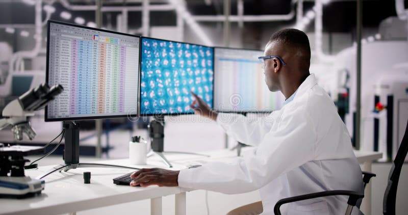 African American Analyzing Spreadsheet Data Stock Image - Image of ...