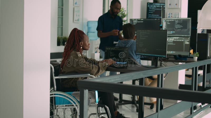 African American App Developer in Wheelchair Analyzing Software Program Stock Footage - Video of ...