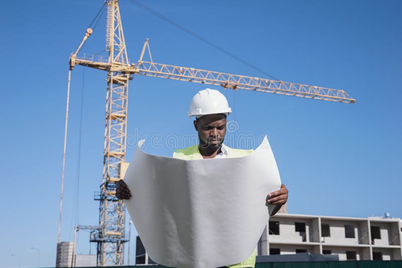 African American Architect Compares Building To Drawings Stock Image ...