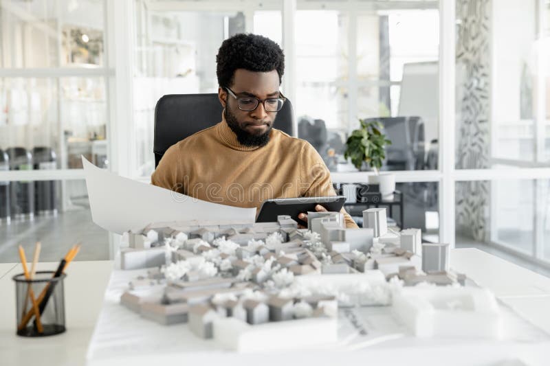 African American Architect Working in His Office and Looking Busy Stock ...