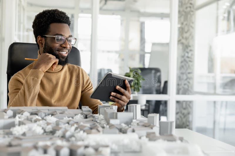 African American Architect Working in His Office and Looking Busy Stock ...