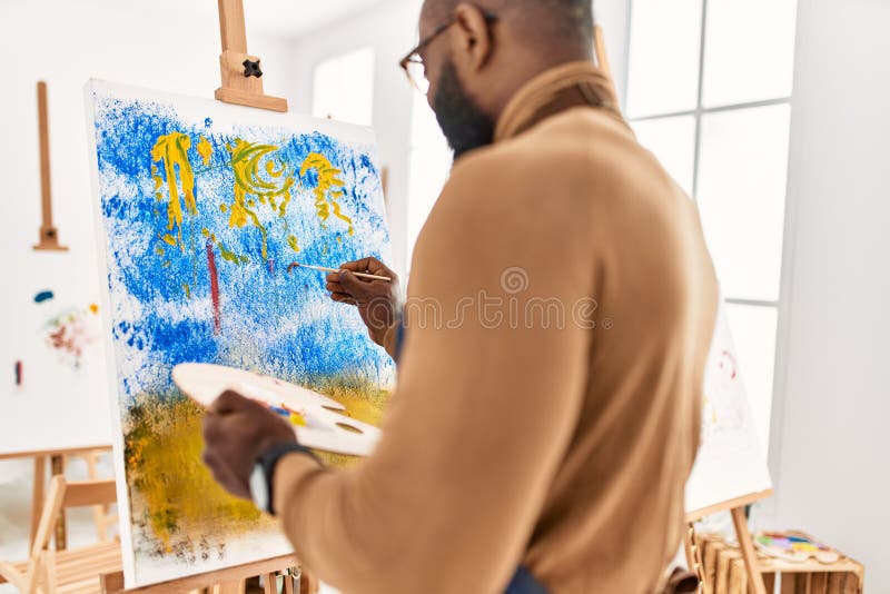 African American Artist Man on Back View Drawing at Art Studio Stock ...