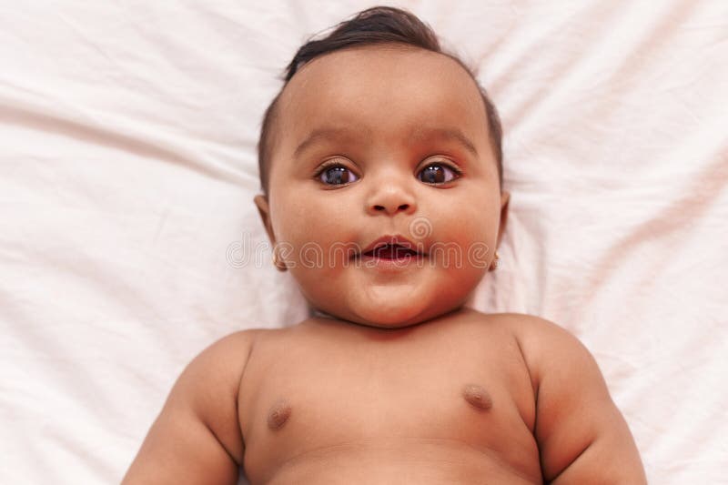 African American Baby Lying on Bed at Bedroom Stock Photo - Image of ...