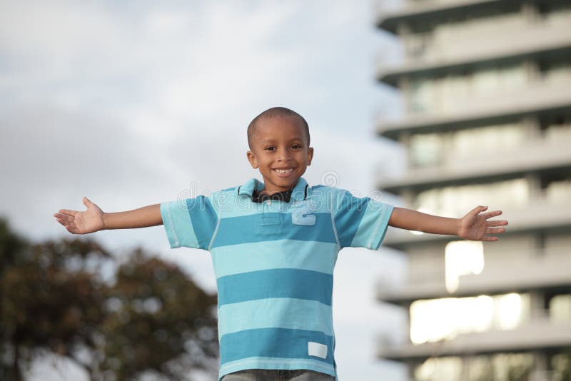 African American Boy with Arms Outstretched Stock Image - Image of male ...