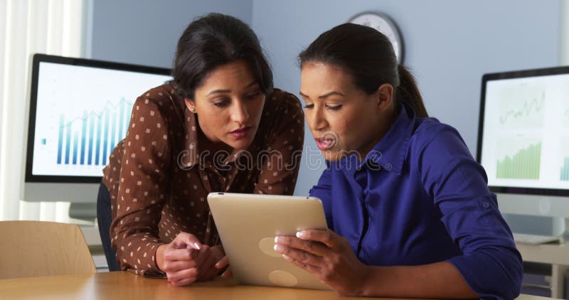 Close Up of Smiling Hispanic Business Woman in Office Looking at Camera ... Close Up of Smiling Hispanic Business Woman in Office Looking at Camera ...