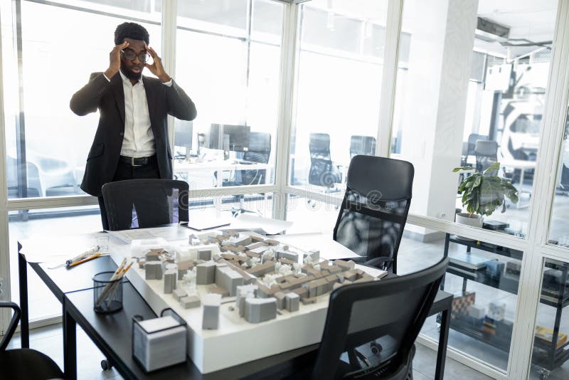 African American Businessman in the Office Looking Busy and Thoughtful ...