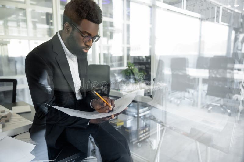 African American Businessman in the Office Looking Busy and Thoughtful ...