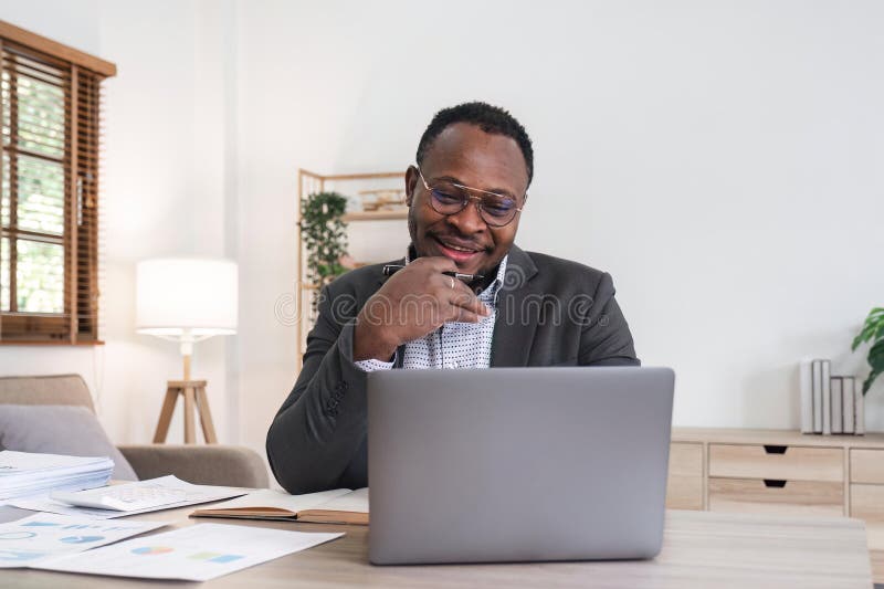 African American Businessman Using His Laptop Computer while Working ...