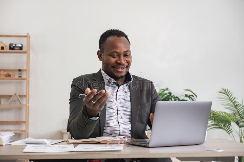 African American Businessman Using His Laptop Computer while Working ...