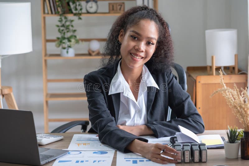 African American Businesswoman Working in the Office Using Laptops ...