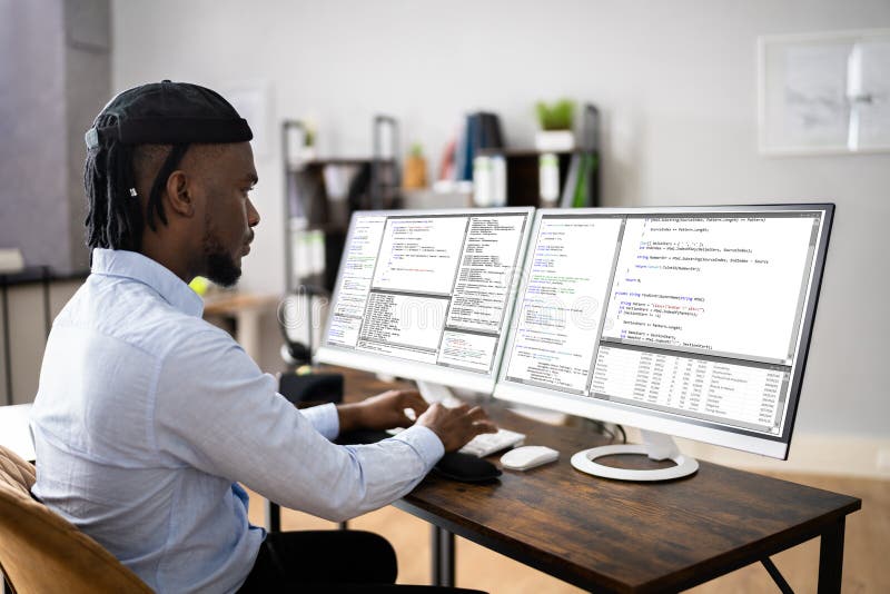 African Coder Using Multiple Computer Screens Stock Photo - Image of ... African Coder Using Multiple Computer Screens Stock Photo - Image of ...