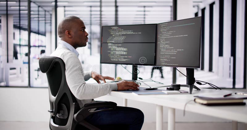 African Coder Using Multiple Computer Screens Stock Photo - Image of office, black: 213589720