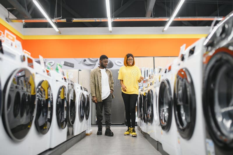 African American Couple Choosing Washing Machine, Electronics Store ...